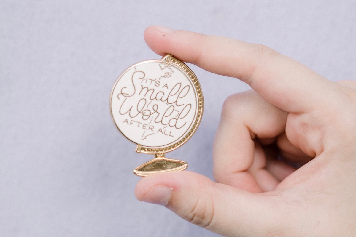 It's a Small World Globe Pin – Charmed & Cozy